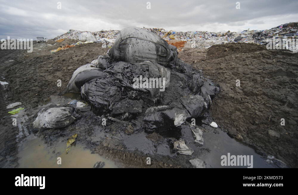 Chemical waste tar and ash in a landfill outside the city Stock Video ...