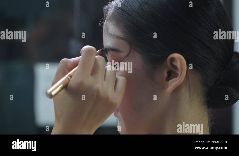 Beauty concept of 4k Resolution. A makeup artist is painting the ...