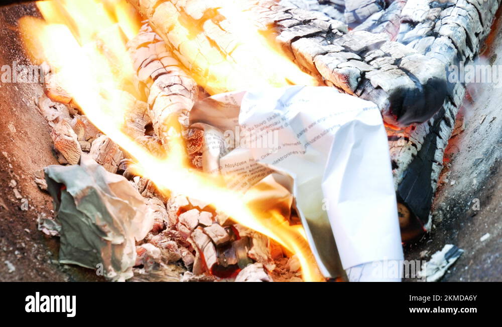 Hiding important documents by burning in hot flame, close up view Stock Video Footage - Alamy