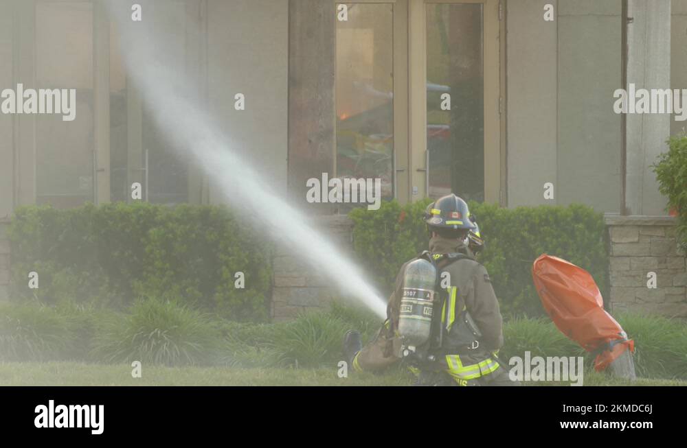 Firefighters wearing full Personal Protective Equipment PPE breathing ...