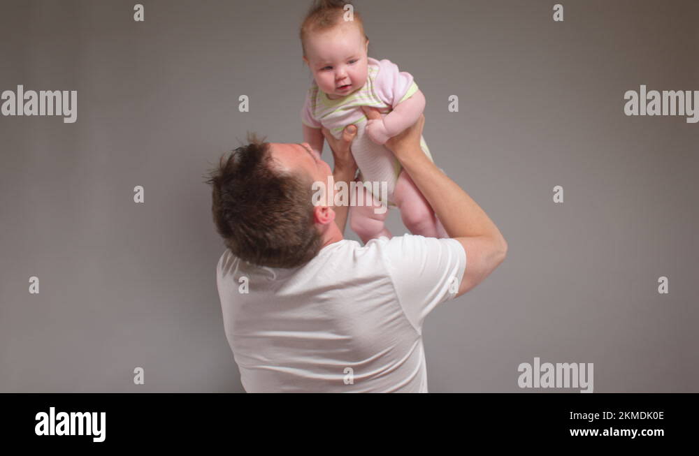 Meeting dad daughter father day, He happily holds in arms, visual ...