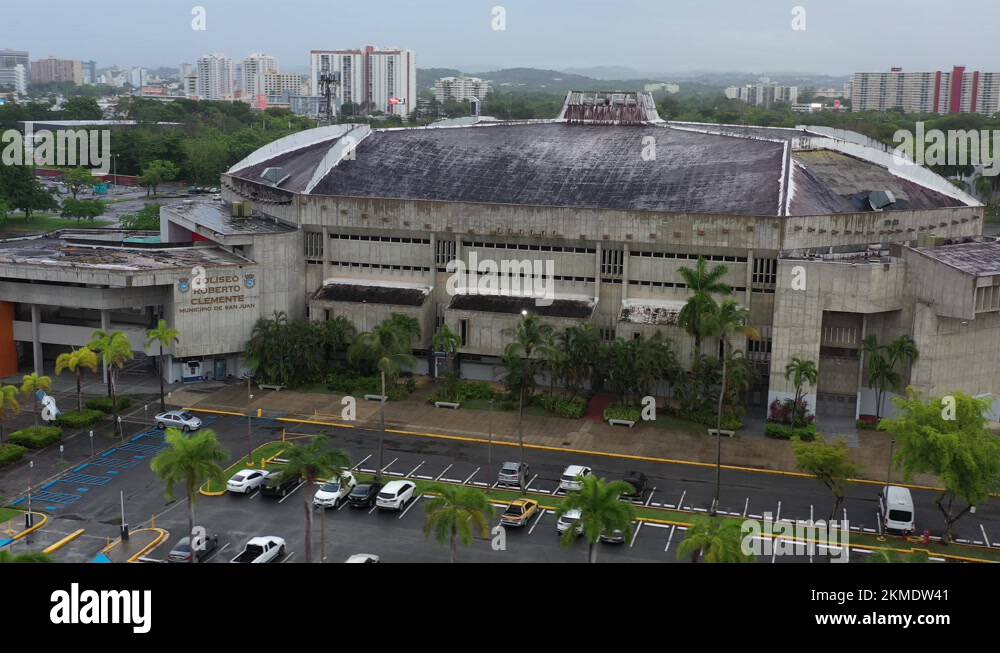 A rotating aerial view of the Coliseo Roberto Clemente in San Juan ...