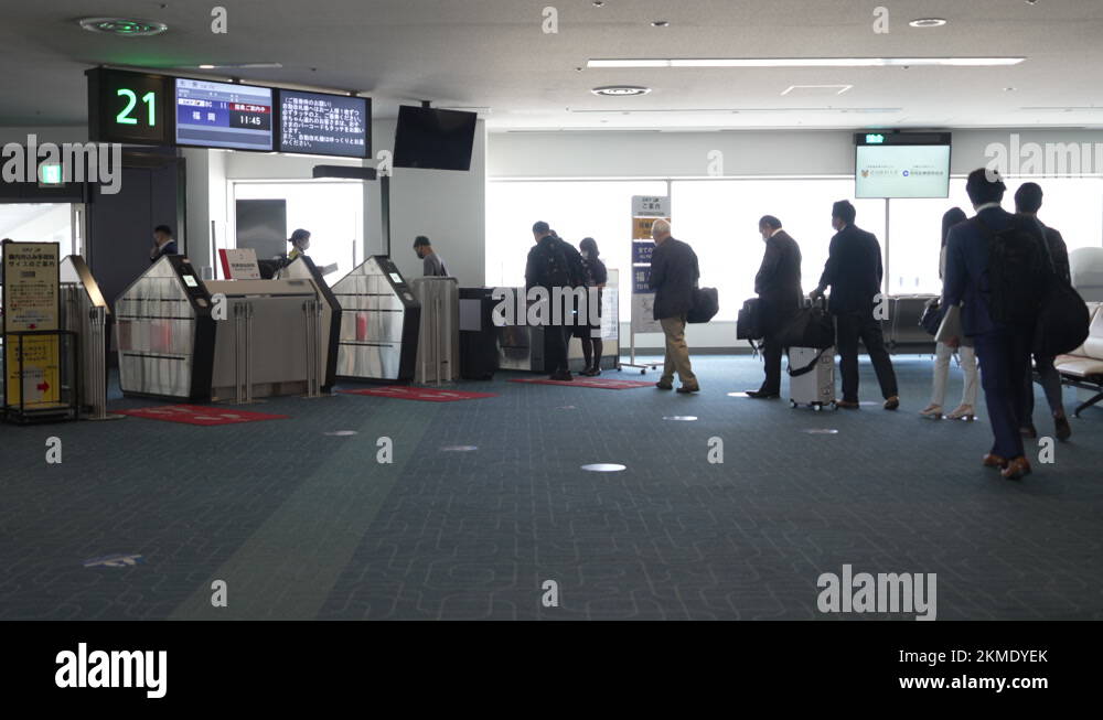 Queue Of Passengers Boarding The Plane At Boarding Gate Of Haneda ...
