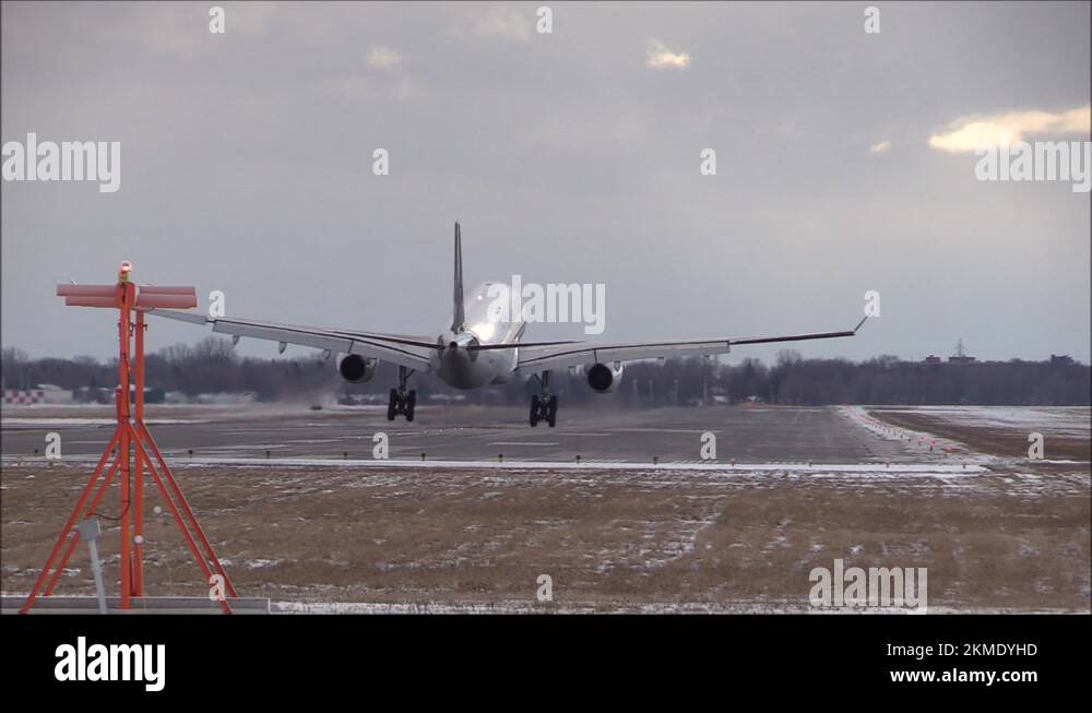 Airplane landing on runway at the airport after a commercial flight ...