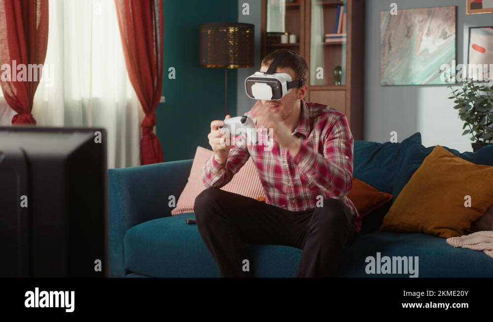Brutal man playing vr video games on console or phone with gamepad ...