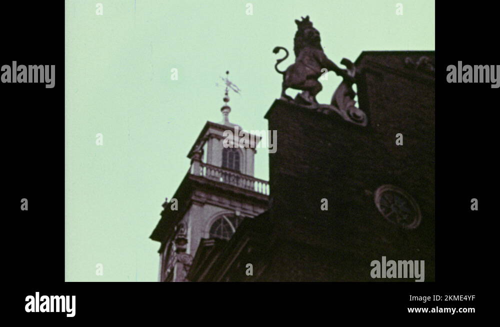 1950s: Rifles and leaned against wall in line. Rooftop of building ...