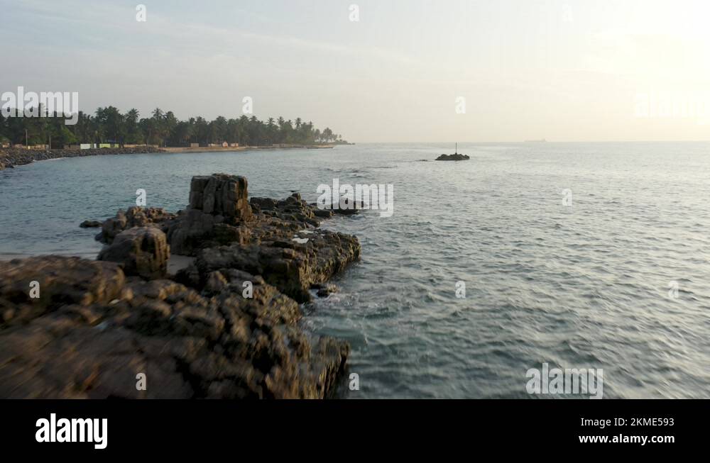 Dawn bright sunlight above sea with rocky shore at Sri Lanka, Salli ...