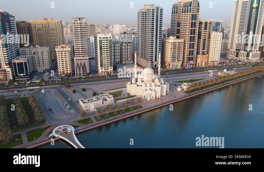 Sharjah aerial view above Al Noor island and mosque and downtown rising ...