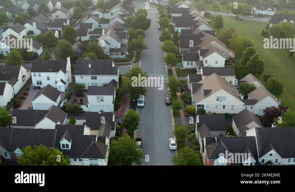 Suburban homes in residential American suburbia. Houses along street in ...