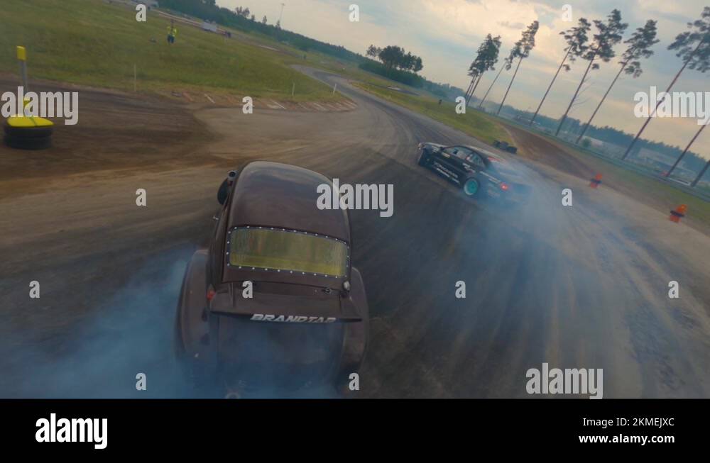 Two drift cars synchronised ride at Lidköping Motorstadion Stock Video ...