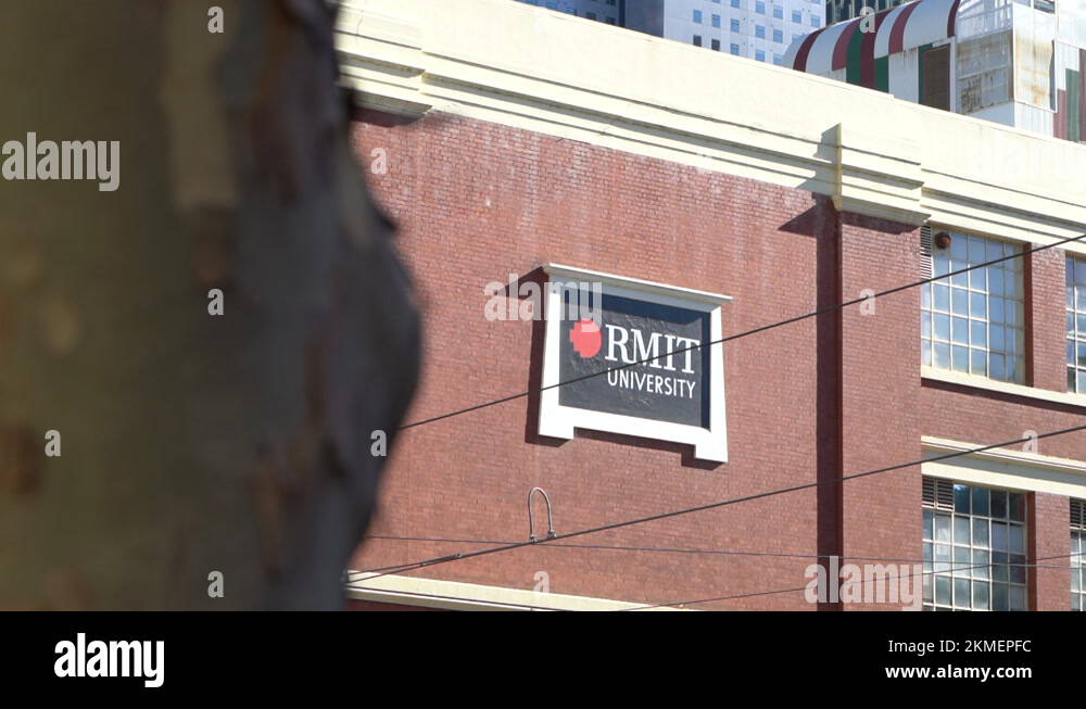 RMIT University logo sign on red brick building wall, reveal shot Stock ...