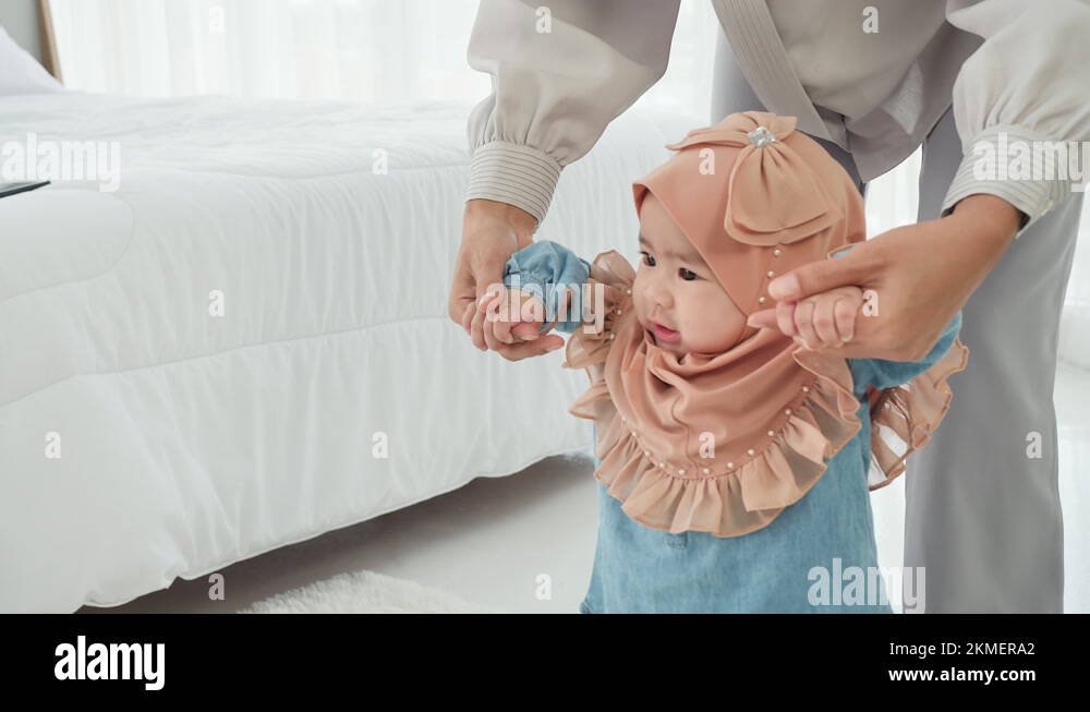 Mother baby girl taking first steps Stock Videos & Footage - HD and 4K ...