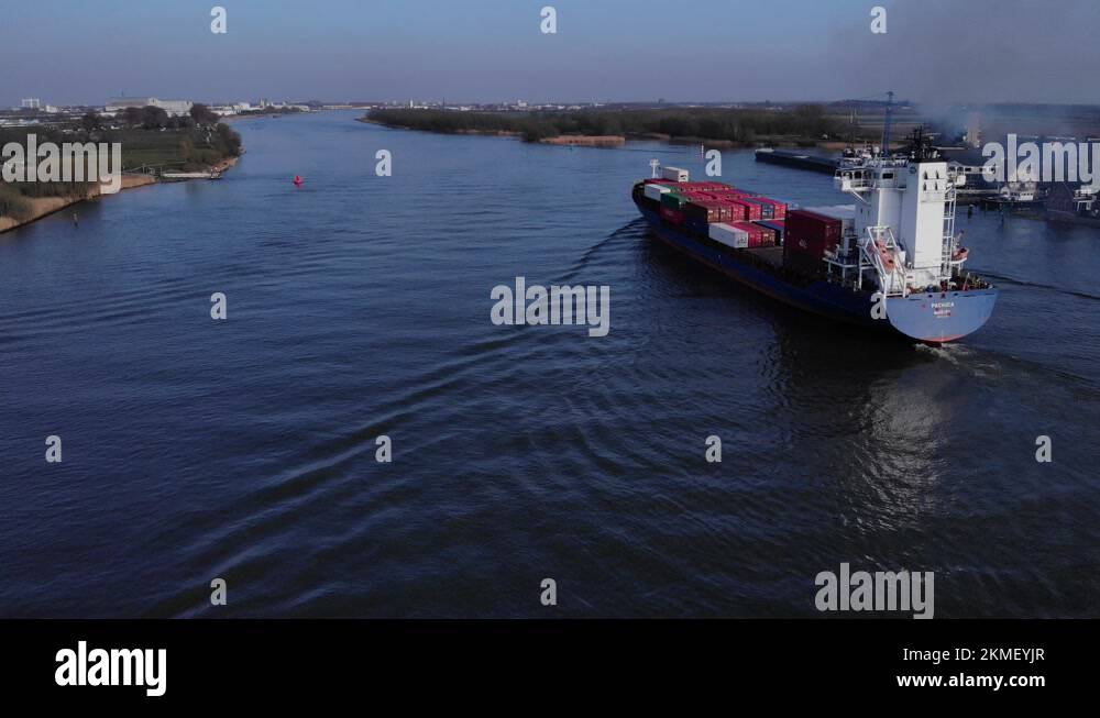 Bird's Eye View Of Cargo Vessel With Shipping Containers Sailing At ...