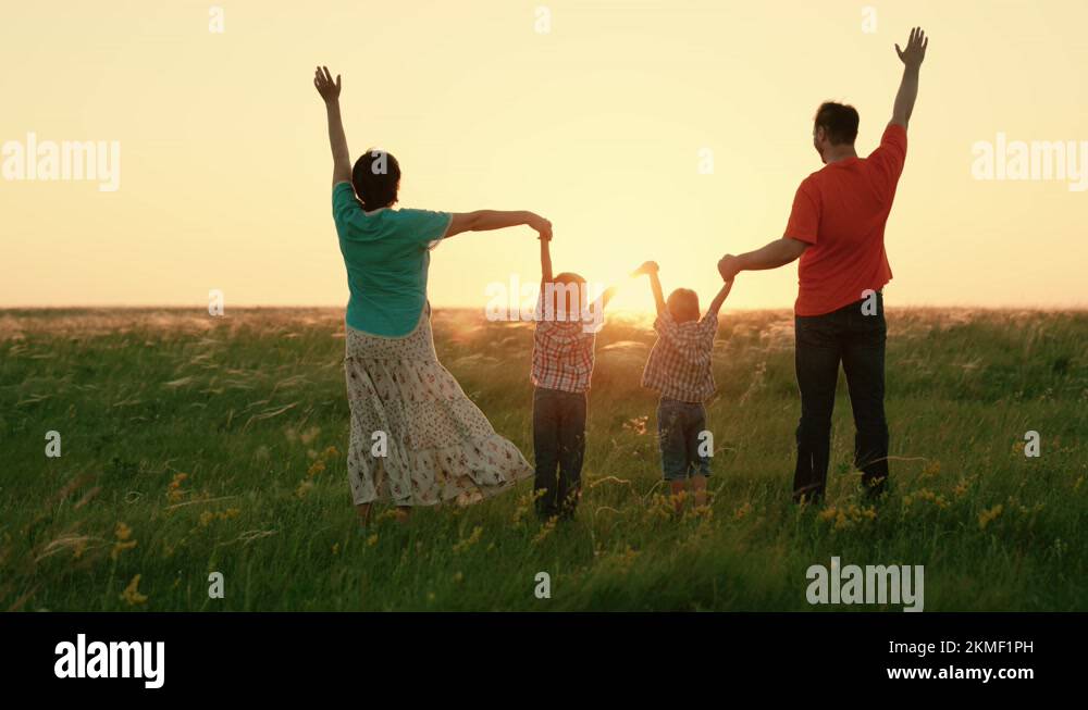 Family joy. Happy family team holding hands together raise their hands ...