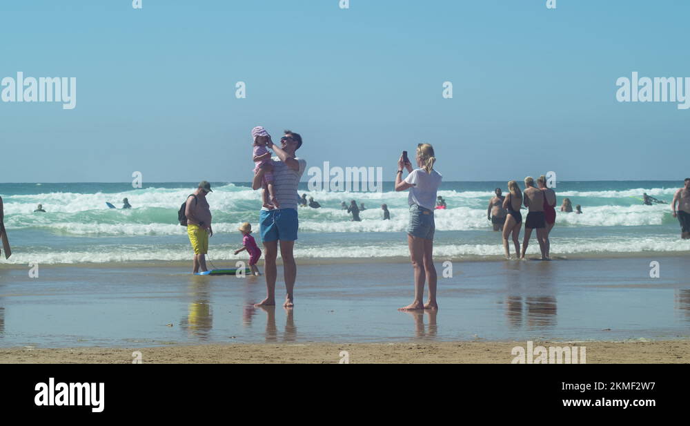 Surfers in the water at perran sands beach at perranporth Stock Videos ...