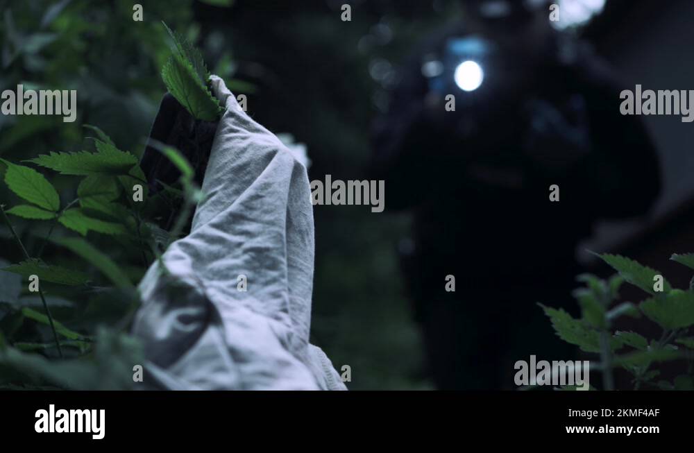 Police Officer Discovers Missing Person's Clothes In The Woods Stock ...