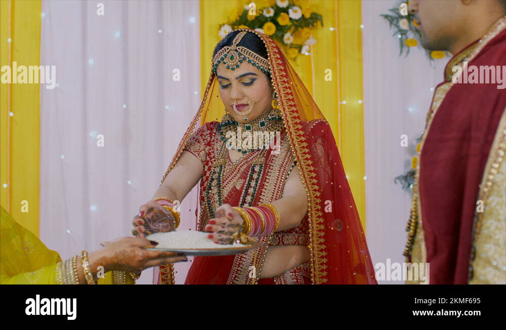 Beautiful bride performing the Vidai/Bidai/Bidaai ritual in a ...