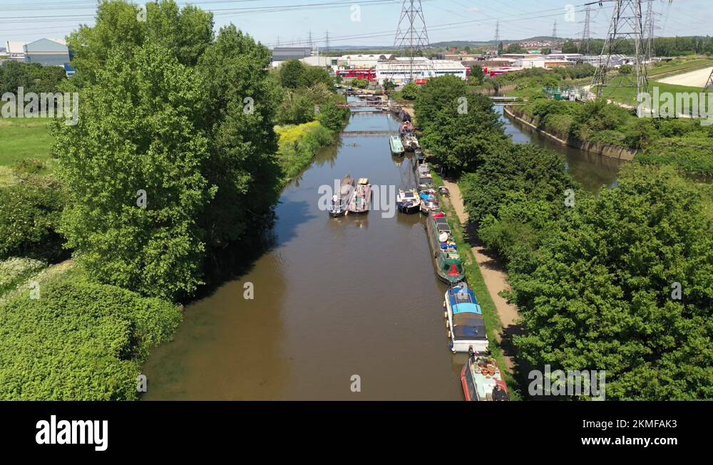 Two branches of river flowing side by, divide by thin stripe of green ...