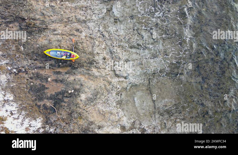 Kayak and paddle on shore, waves washing on rocky beach, Dugi Otok ...
