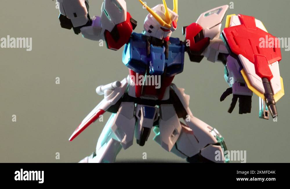 GATX 105BFP Gundam model in a battle-ready pose under cinematic ...