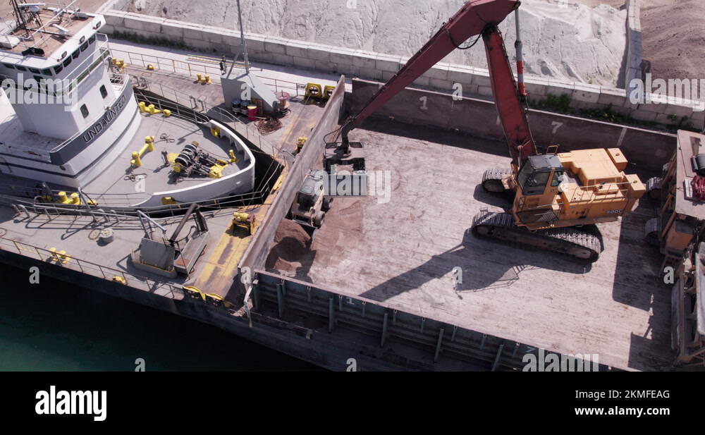 Bird's Eye View Of Loader Machine At Work Inside The Gravel Ship At ...