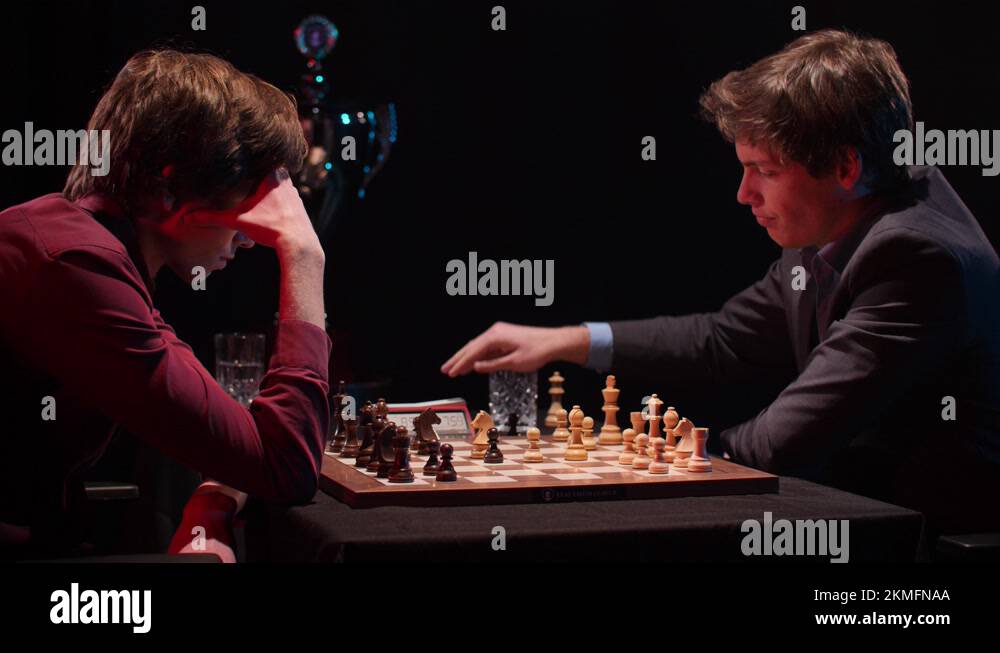 Two men locked in intense ranked chess match plan their next moves in ...