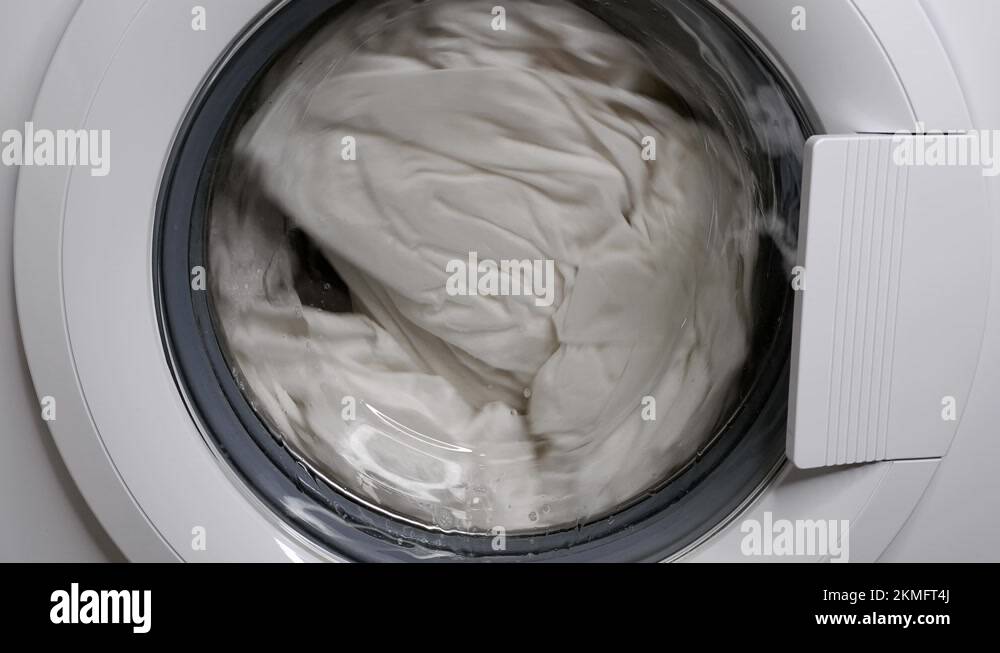 Washing clothes in a washing machine. The laundry is washed Stock Video ...