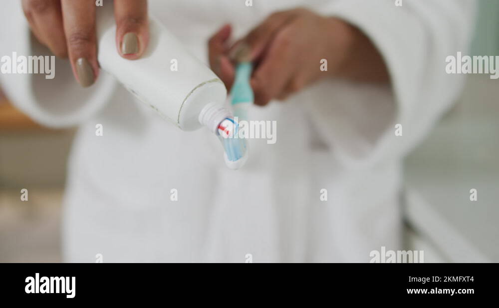 Woman putting toothpaste on toothbrush Stock Videos & Footage - HD and ...