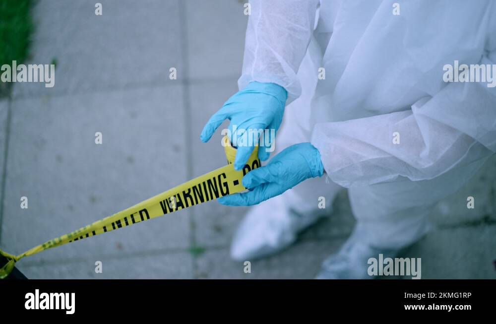 CSI Unravel Barricade Tape 'Do Not Cross' At Crime Scene Outside In ...