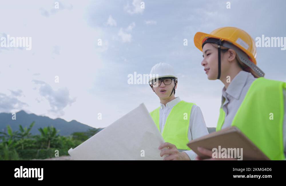 Two civil engineer worker having conversation together on construction ...