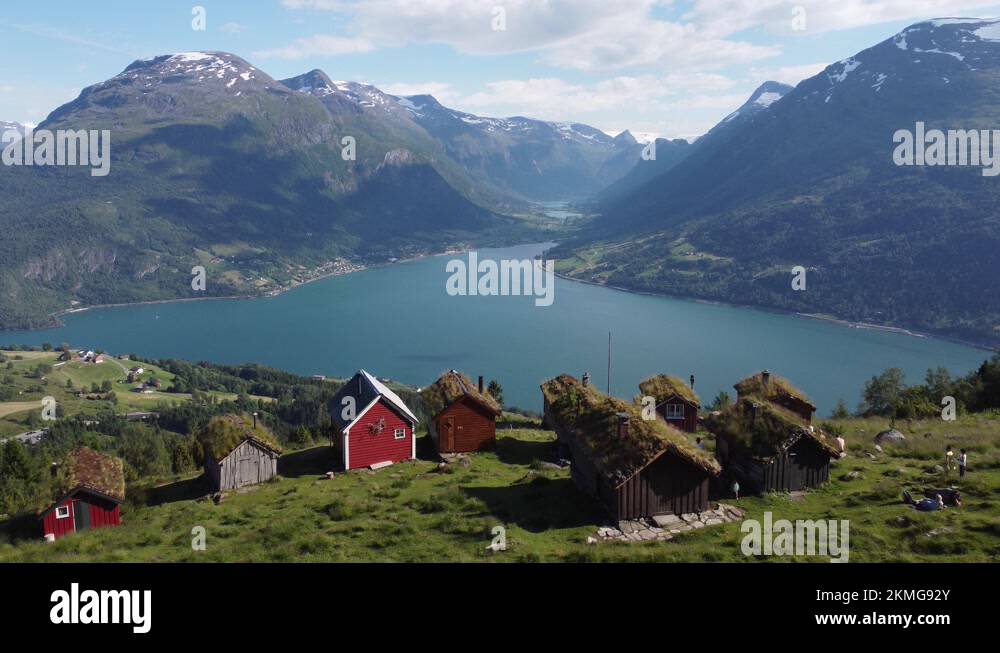 Raksetra Loen forward moving aerial over rural cottage rooftops showing ...