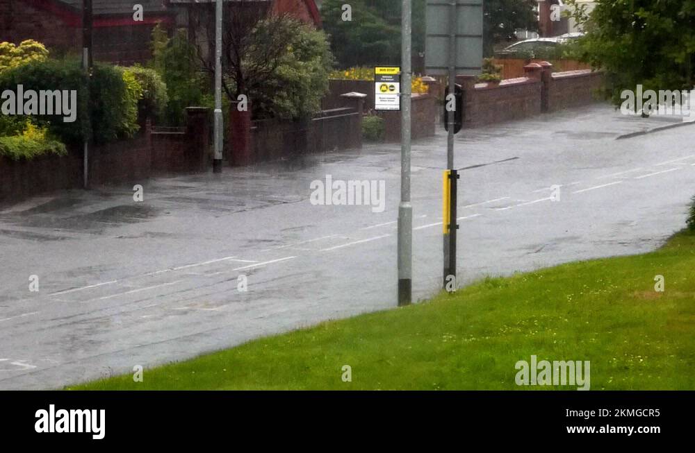 Cars driving in stormy flooding heavy country road rain pouring ...