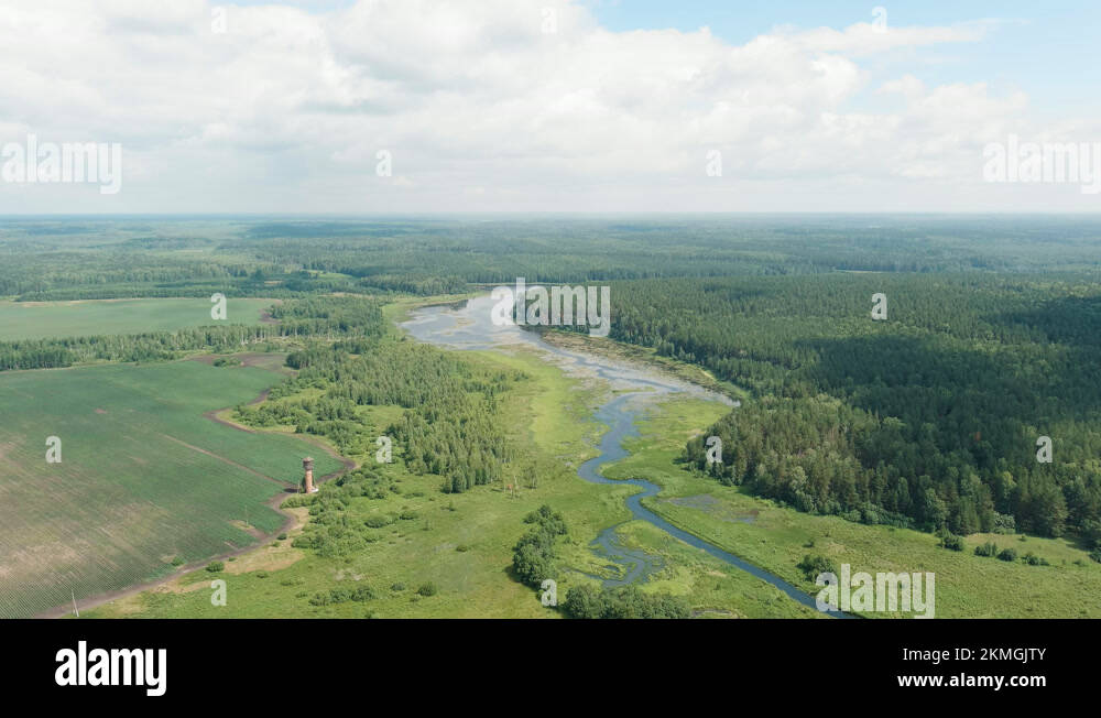 Russia, Ural. Takeoff over fields and forests. Swampy Pond. Shadows on ...