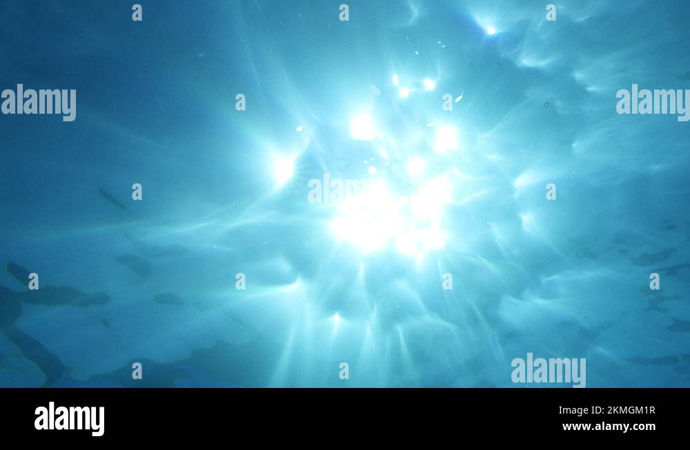 Sun penetrating ocean surface. Underwater god rays vfx background ...