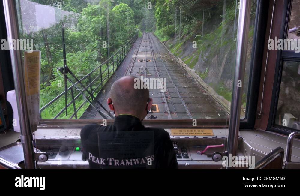 A Peak tram operator drives the iconic wooden tram, operative since ...