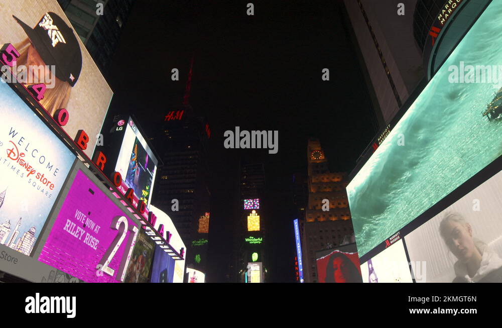Tilt Down From Brightly Lit Signage In Times Square, New York City, U.S ...