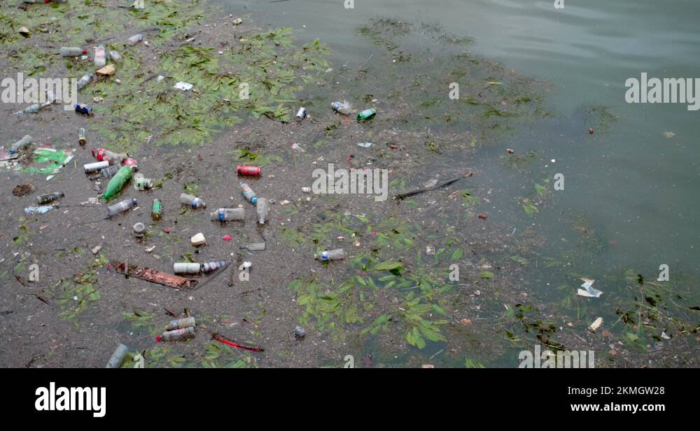 Garbage in water. Improper Waste Management - Used plastic water ...