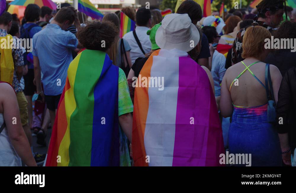 LGBTQ Rights In A Pride Parade - Back View Of People Wearing LGBTS ...