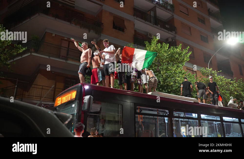 ROME, ITALY - JULY 11, 2021: Drunk street Italian hooligans on bus roof ...