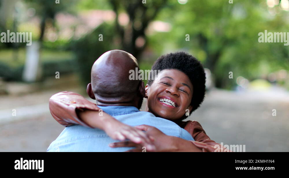 African people hugging, woman running towards partner hugs and embrace ...