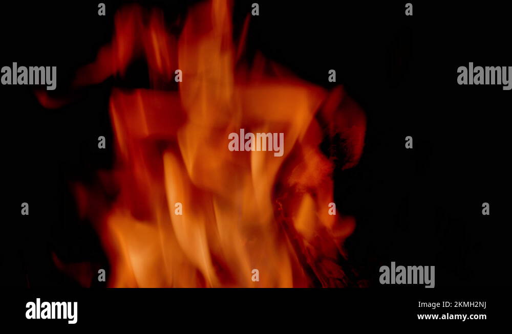 Real fireplace full of wood and fire. Flames and burning sparks fire ...