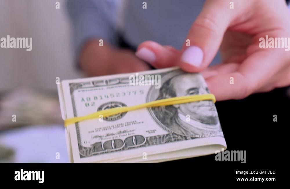 Business Woman Displaying a Spread of Cash US dollars. Close-up. Income ...