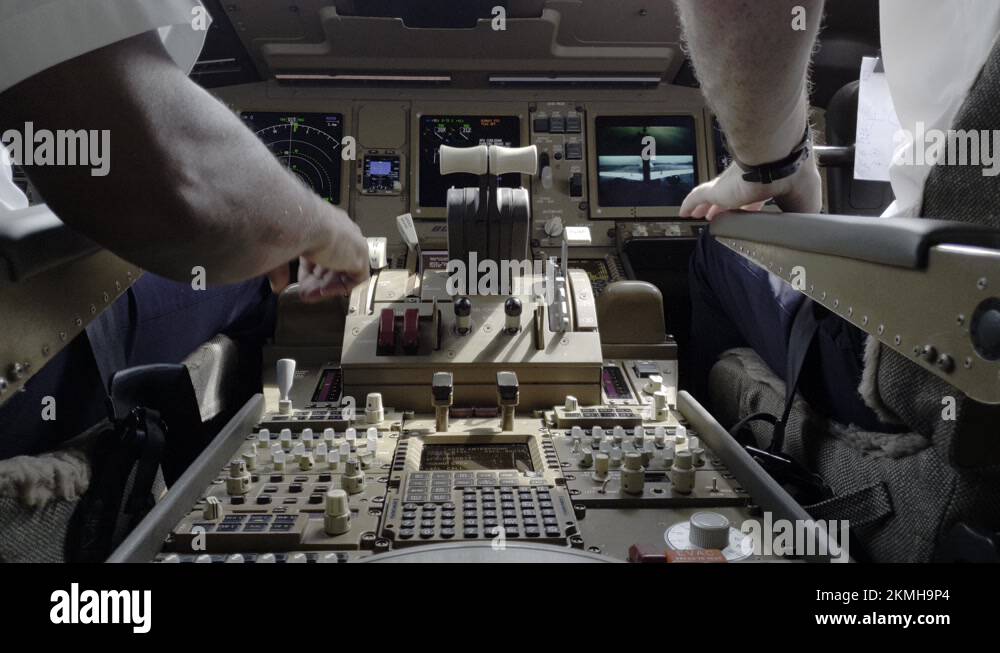 Cockpit panel, buttons layout, a pilot in command using control ...