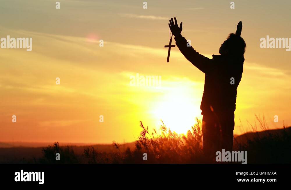 Man holding a cross Stock Videos & Footage - HD and 4K Video Clips - Alamy