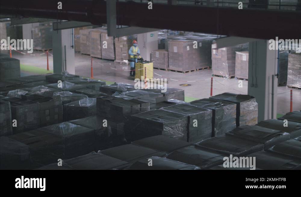 Cargo boxes in large supply chain factory warehouse, ready to be ...