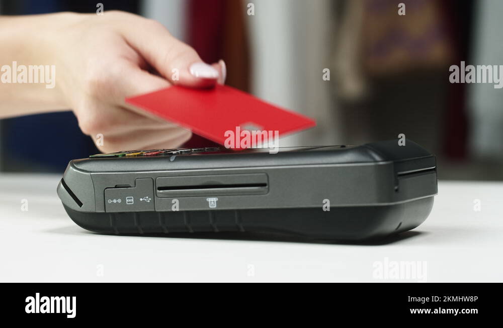 Close-up of payment by credit card via the terminal without entering ...