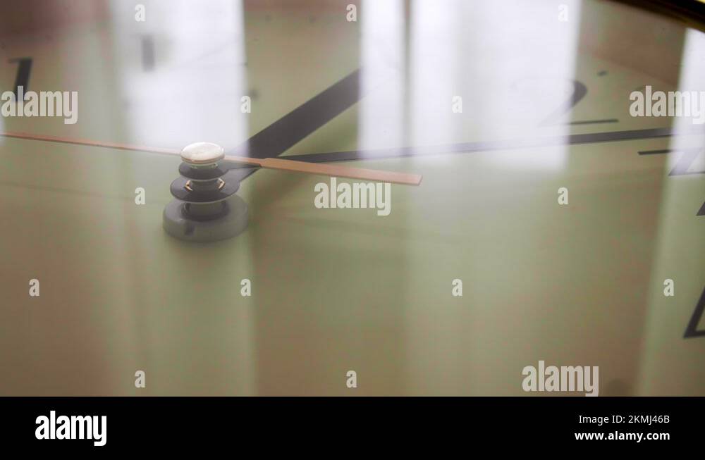 Close up to a wall clock with a running time pointer. The Wall clock ...