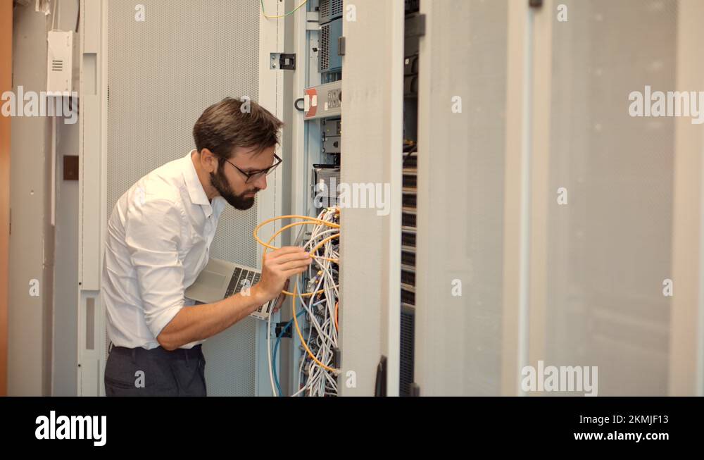 Connecting Lan Cable To Mainframe.IT Engineer Patching Network Stock ... Connecting Lan Cable To Mainframe.IT Engineer Patching Network Stock ...