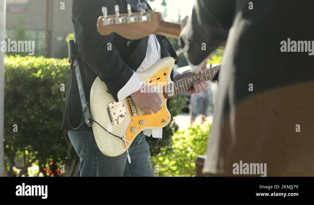 Man Lead Guitarist Playing Electrical Guitar At Daytime Outdoor Concert ...