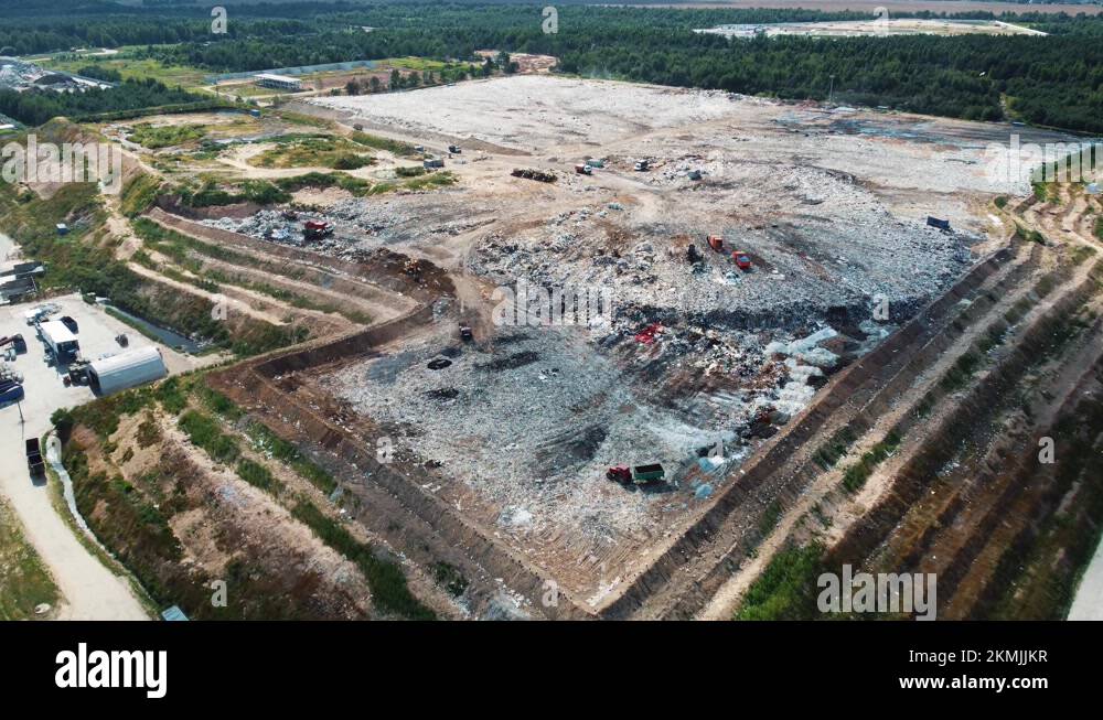 Big city garbage dump with bulldozers and garbage trucks Stock Video ...